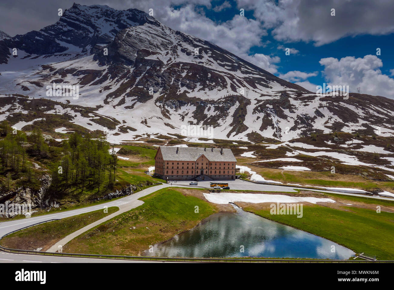 Simplon Hospitz yellow post bus and snowy weather in the mountains on ...