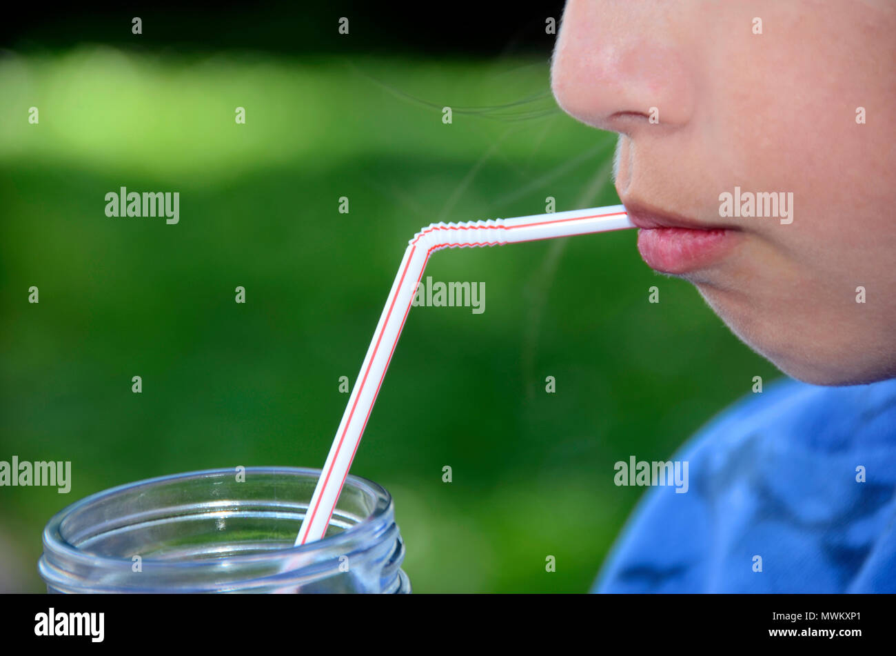 Straw In Mouth Stock Photos & Straw In Mouth Stock Images - Alamy