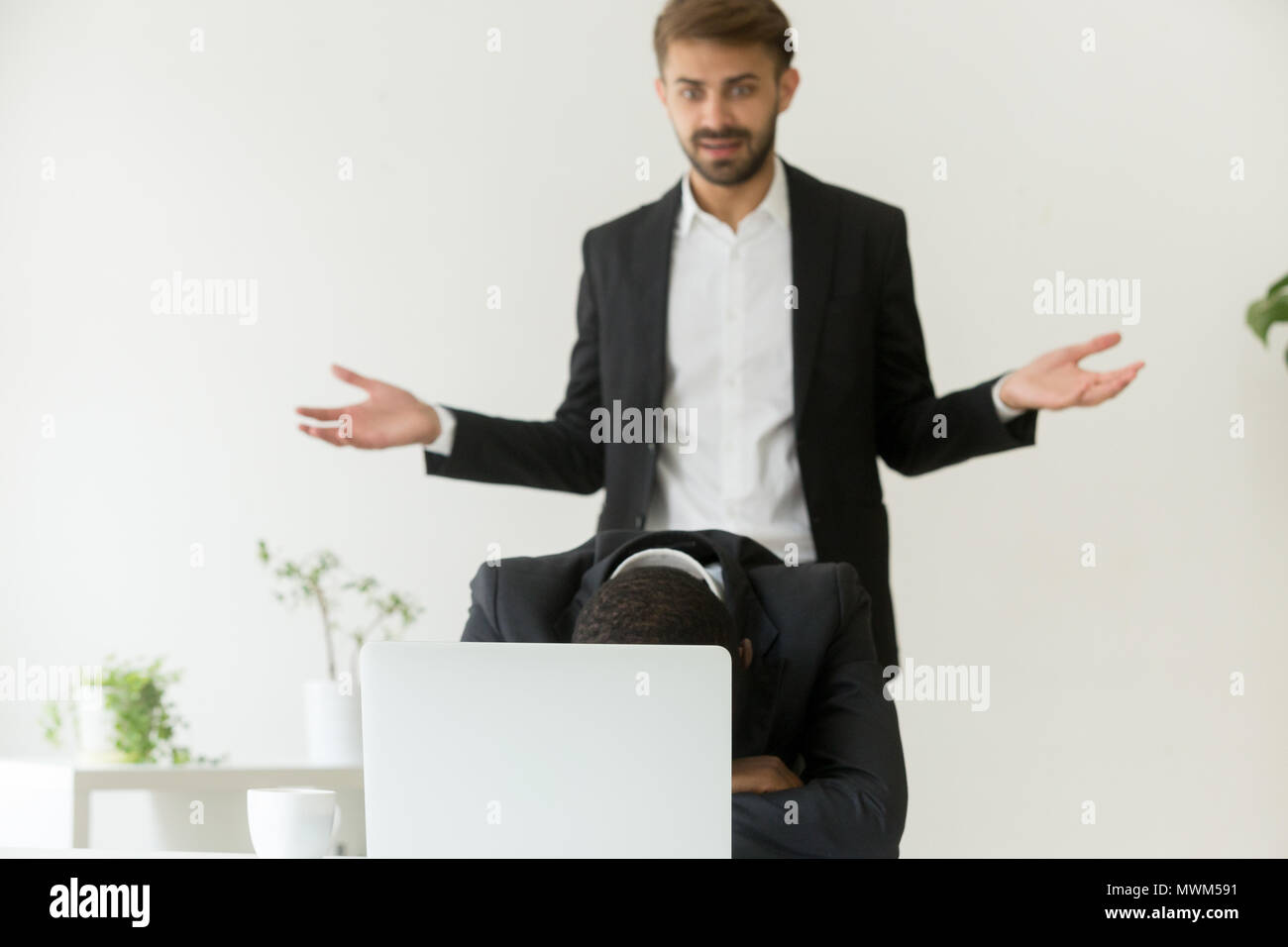 Shocked employer watching subordinate sleeping at workplace Stock Photo ...