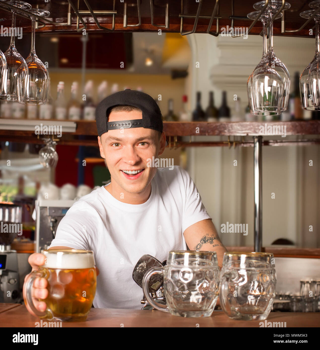 Barman giving beer hi-res stock photography and images - Alamy