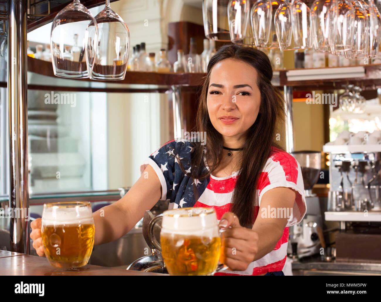 Portrait of young woman holding beer mug hi-res stock photography and ...