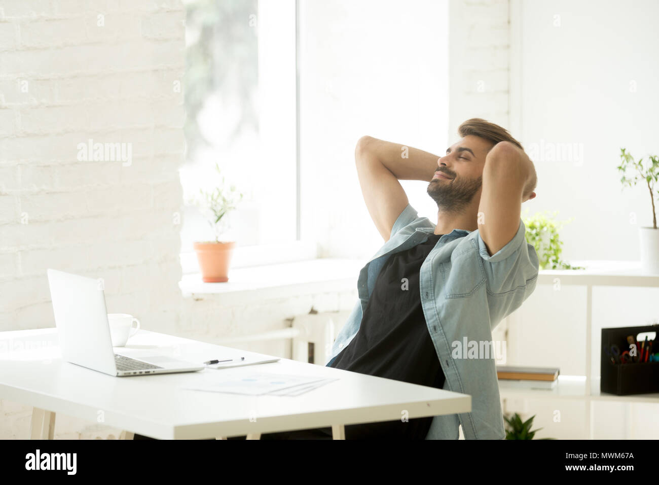 Businessman desk office leaning back hi-res stock photography and ...
