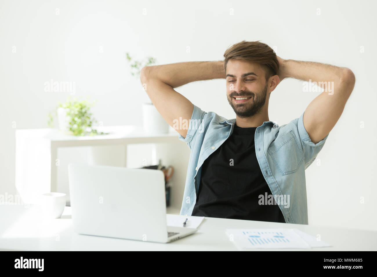 Relaxing in chair hi-res stock photography and images - Alamy