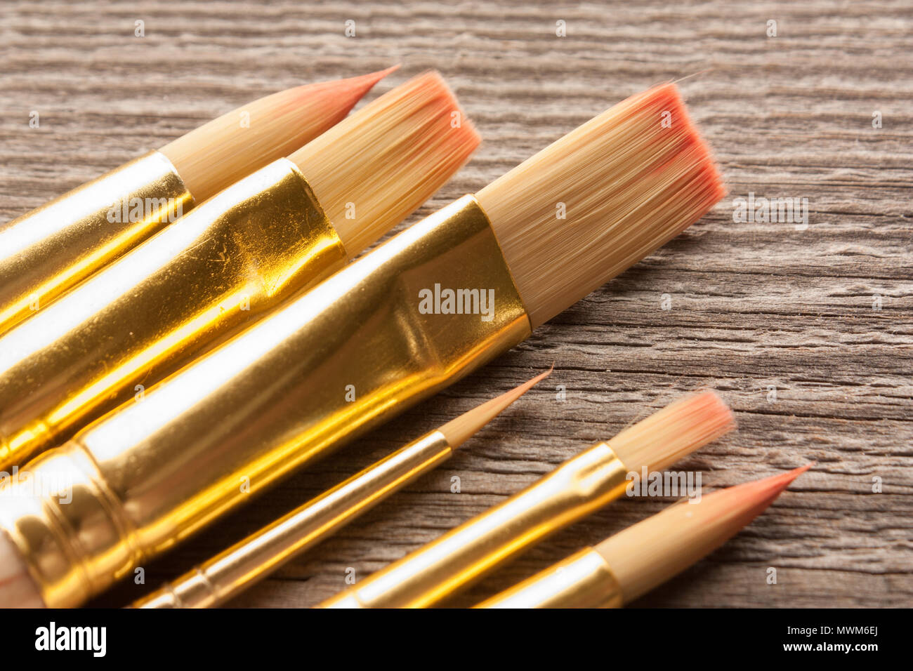 New and clean nylon brushes on wooden table Stock Photo - Alamy