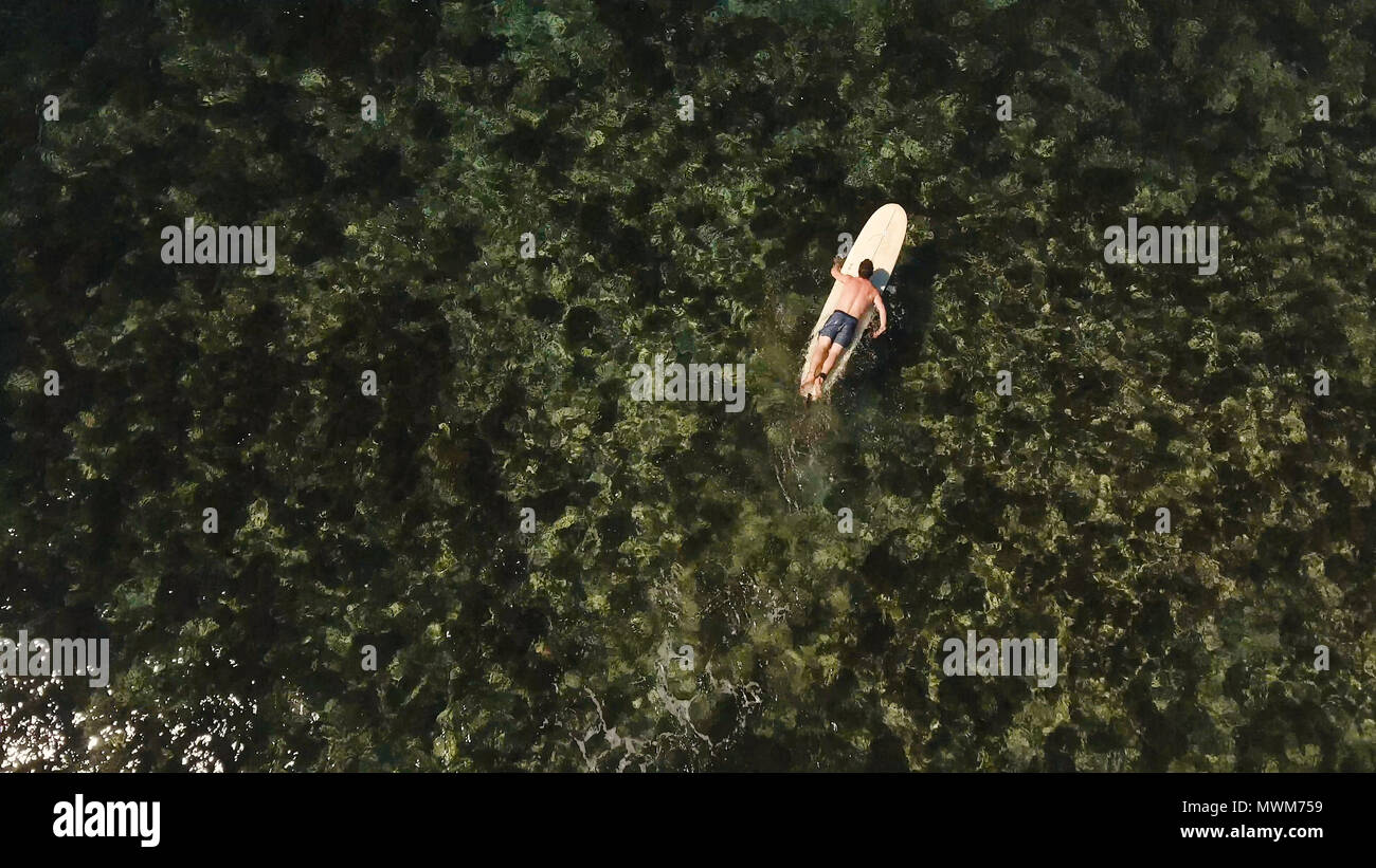Surfers at siargao islands famous surf break cloud 9 near mindanao the ...