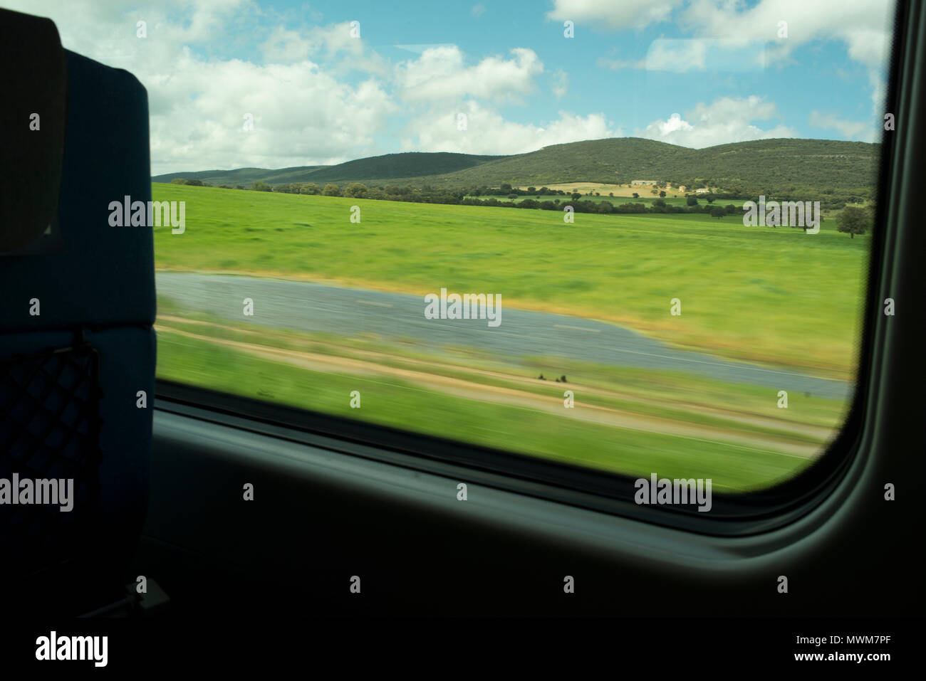 View from high speed train window in motion of countrysideand sky on ...