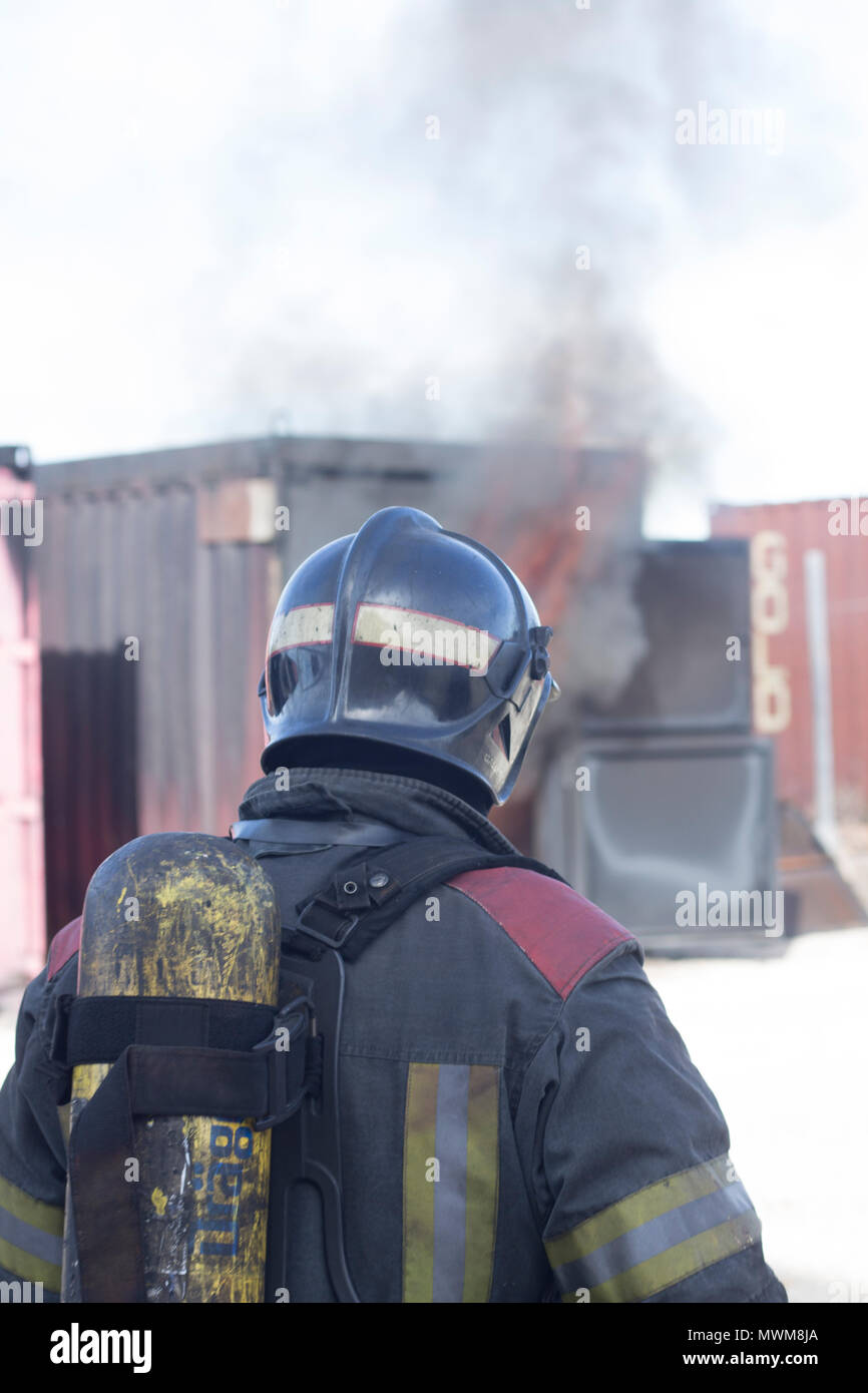 Firefighter putting out fire training station extinguisher backdraft ...