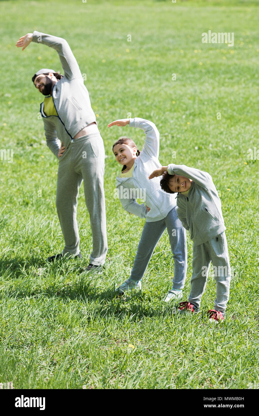 Happy sportive family doing hi-res stock photography and images - Alamy