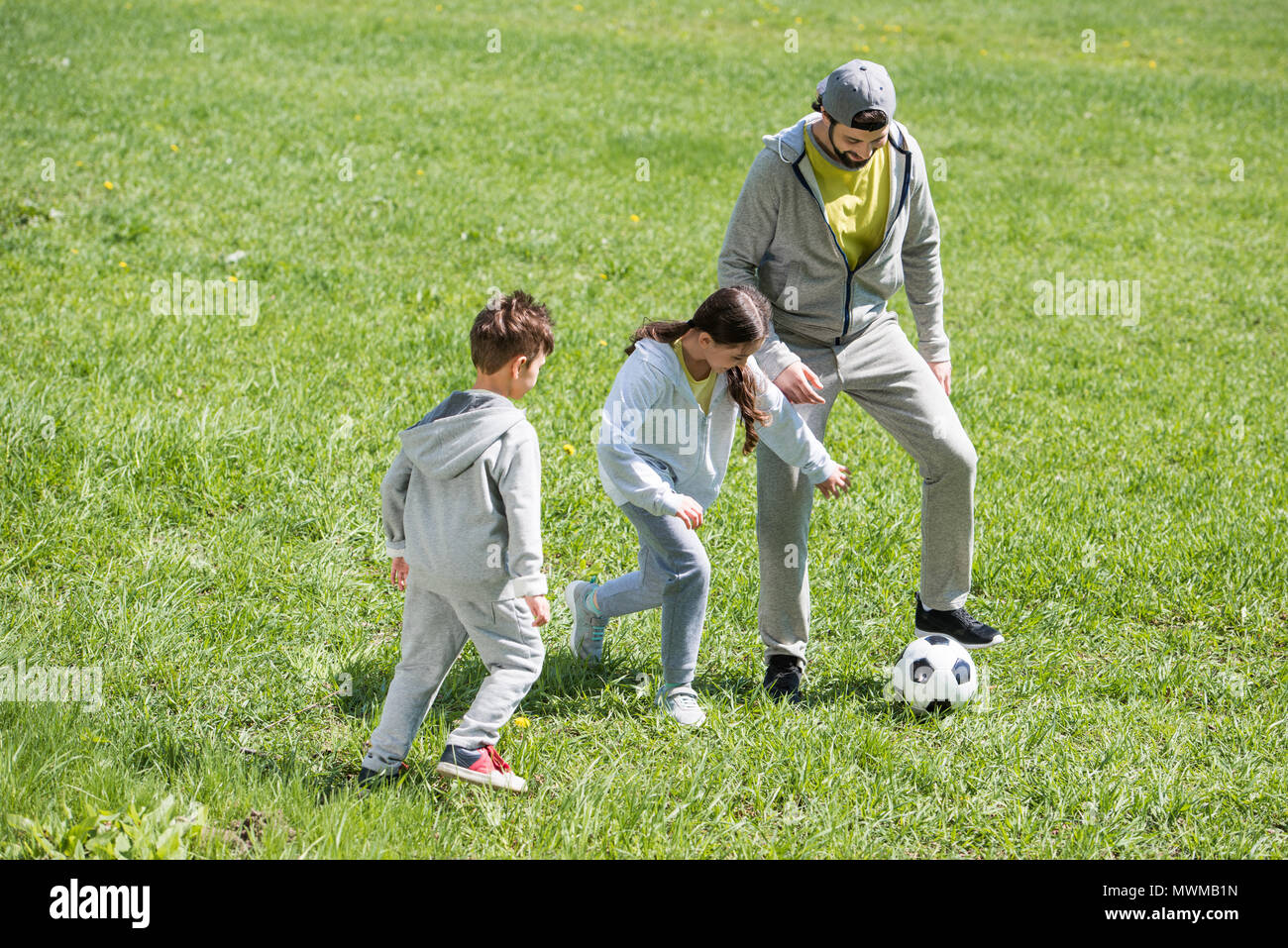 Father daughter playing football in hi-res stock photography and images ...