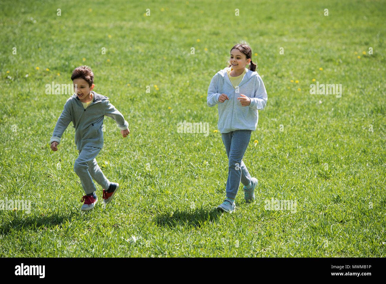 Boy running on meadow hi-res stock photography and images - Alamy