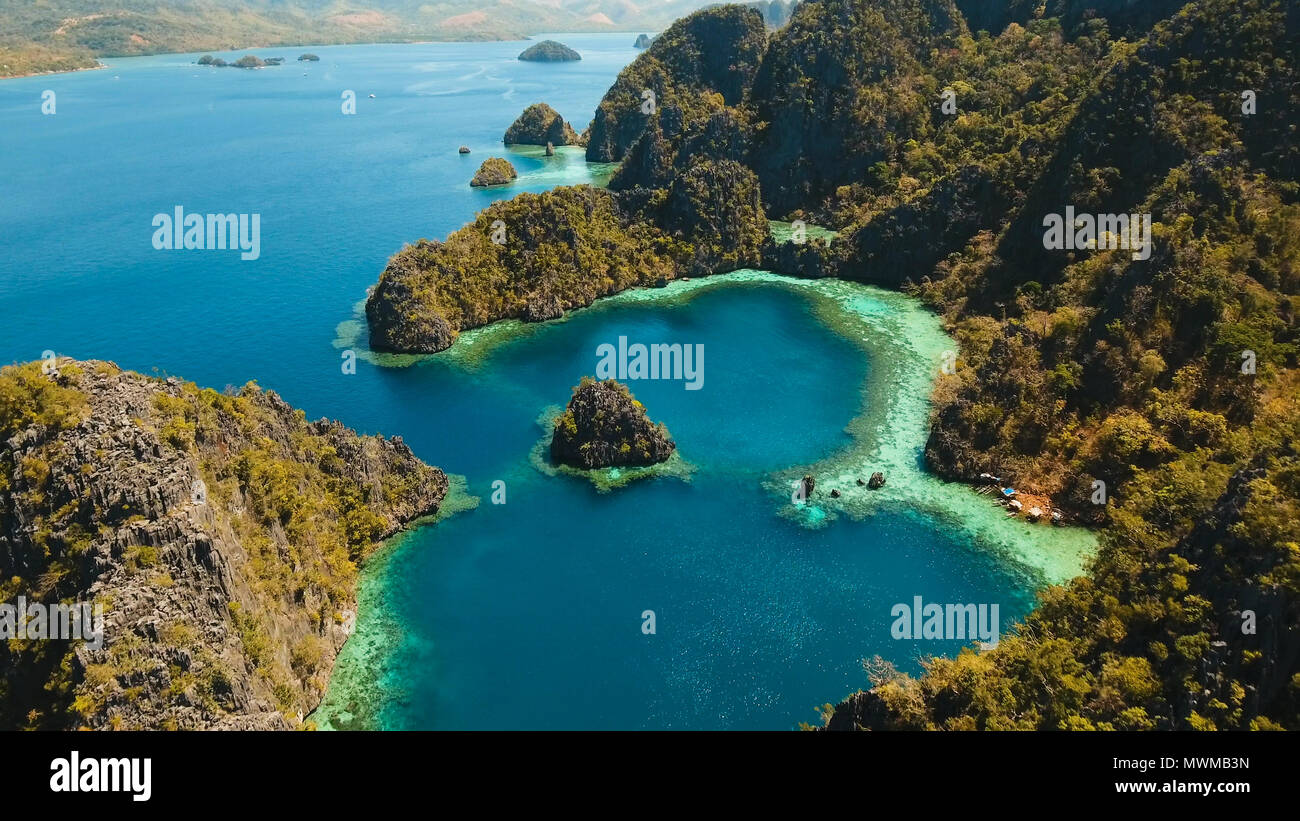 Tropical lagoon with azure water, beach by the Kayangan Lake ...