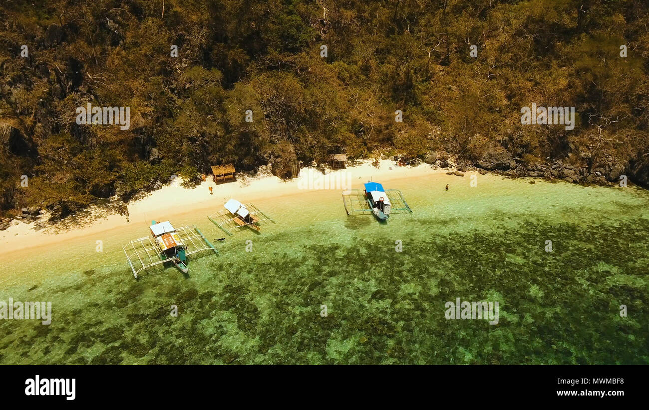 Aerial view: Lagoon with blue, azure water in the middle of small ...