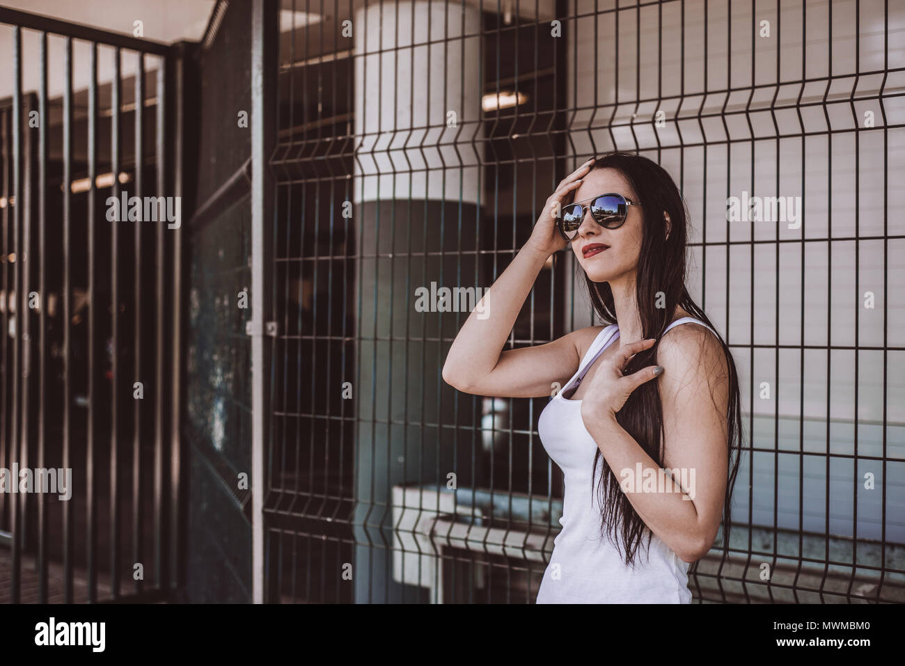 Beautiful, authentic and smiling girl poses for photos. Brown color ...