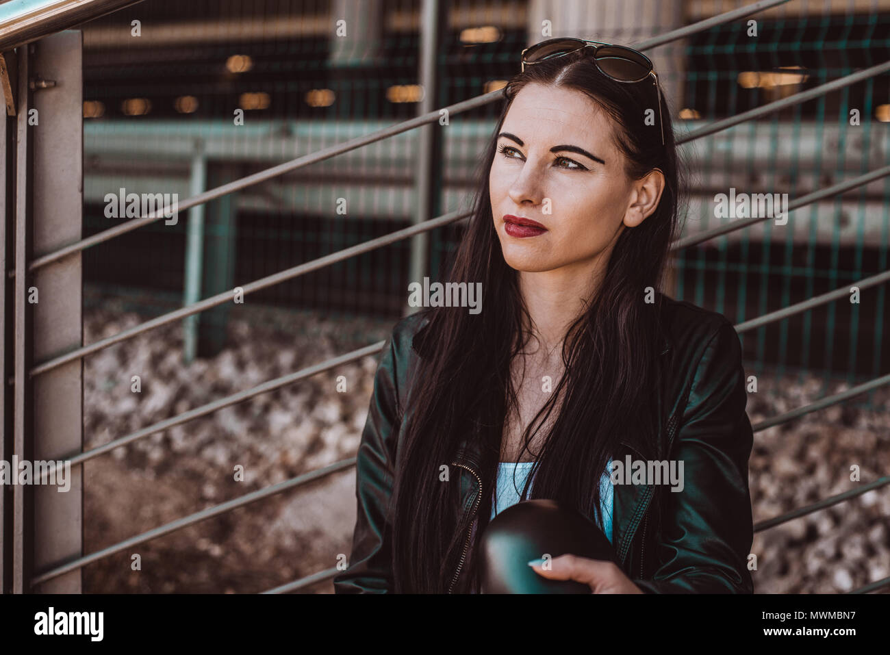 Beautiful, authentic and smiling girl poses for photos. Brown color ...