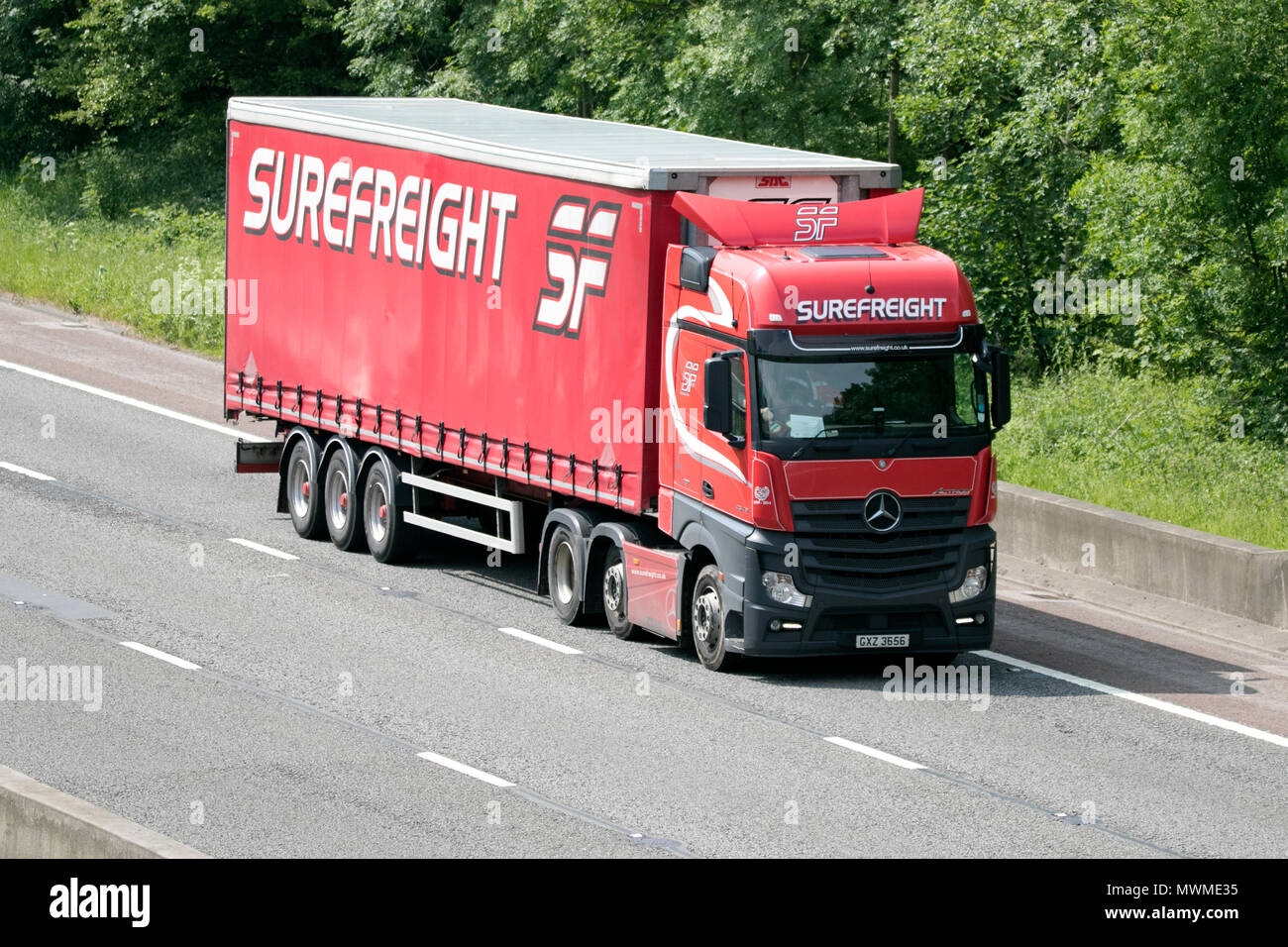 surefreight transport mercedes logistics HGV lorry M6 motorway Stock ...