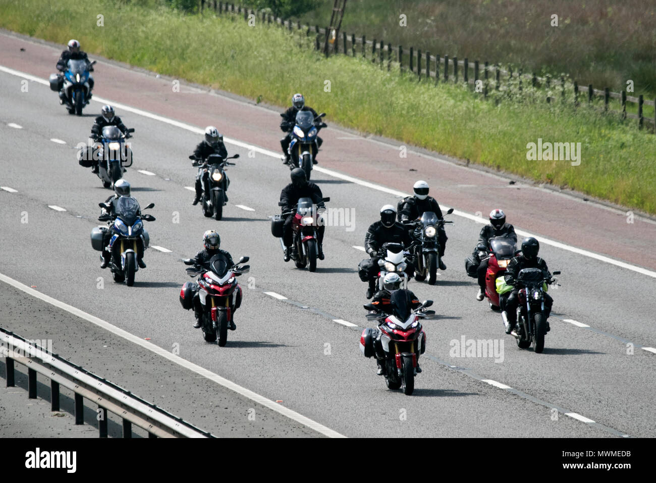 a group or gang of bikers heading up the M6 motorway Stock Photo - Alamy