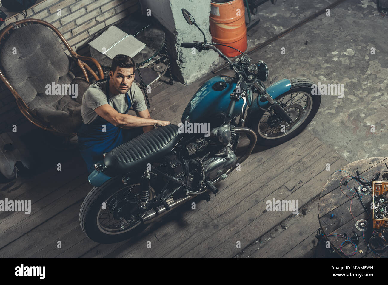 Mechanic working on motorbike hi-res stock photography and images - Alamy