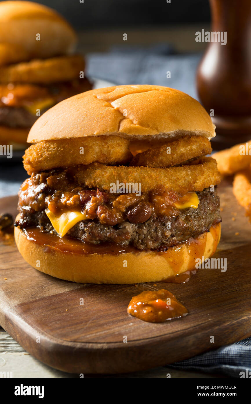 Homemade Barbecue Chili Cheeseburger with Onion Rings Stock Photo - Alamy