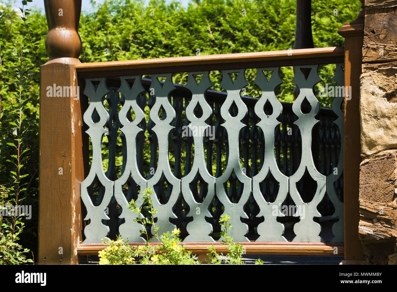 Balusters and railings on the veranda of an old residential log home ...