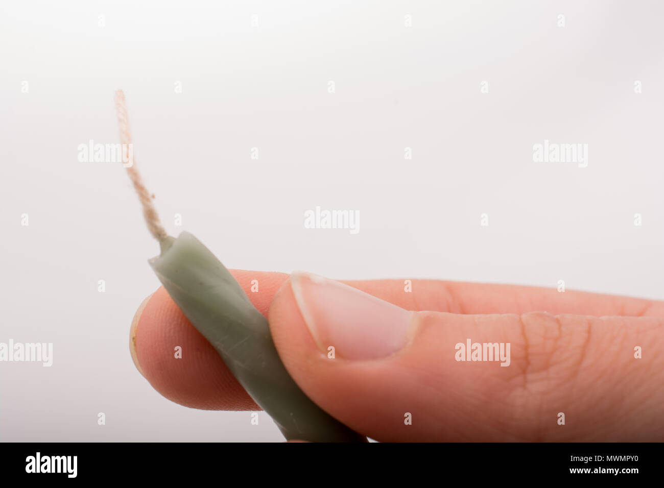 Colorful candle stick in hand on a white background Stock Photo - Alamy