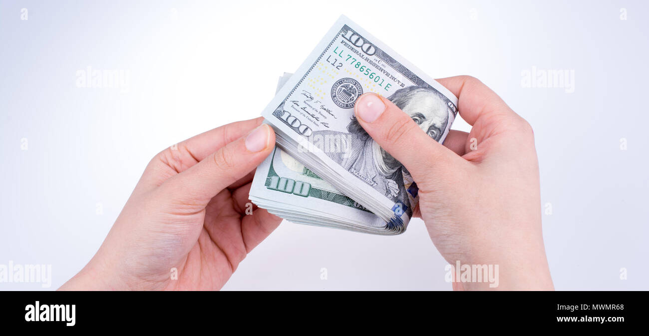 Human hand holding American dollar bill as money isolated on white ...