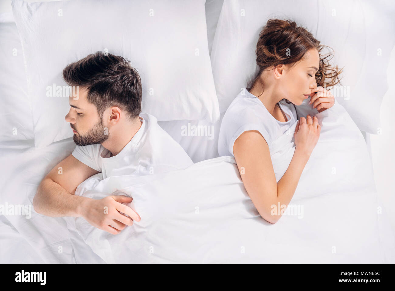 Woman sleeping in bed back view hi-res stock photography and images - Alamy