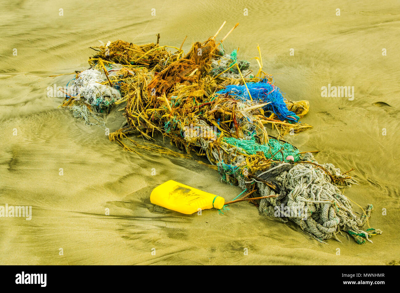 Outdoor view of fishing net and ropes garbage in the beach, every day ...