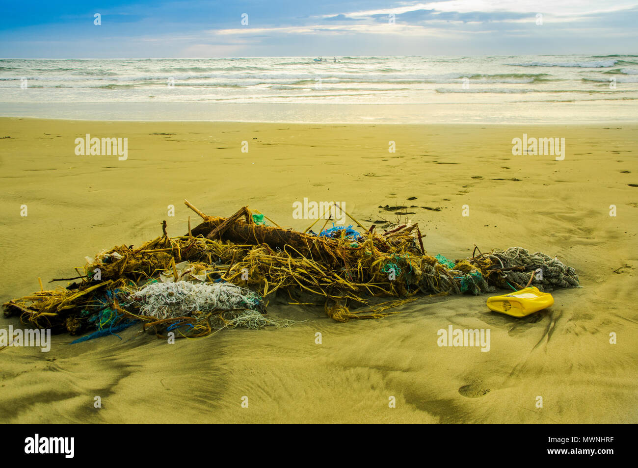 Outdoor view of fishing net and ropes garbage in the beach, every day ...