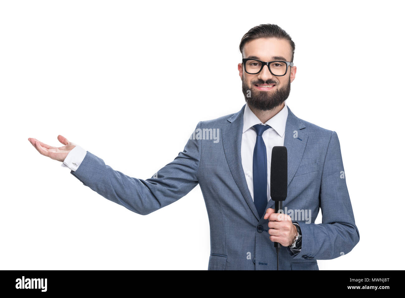 handsome smiling male journalist with microphone presenting something ...