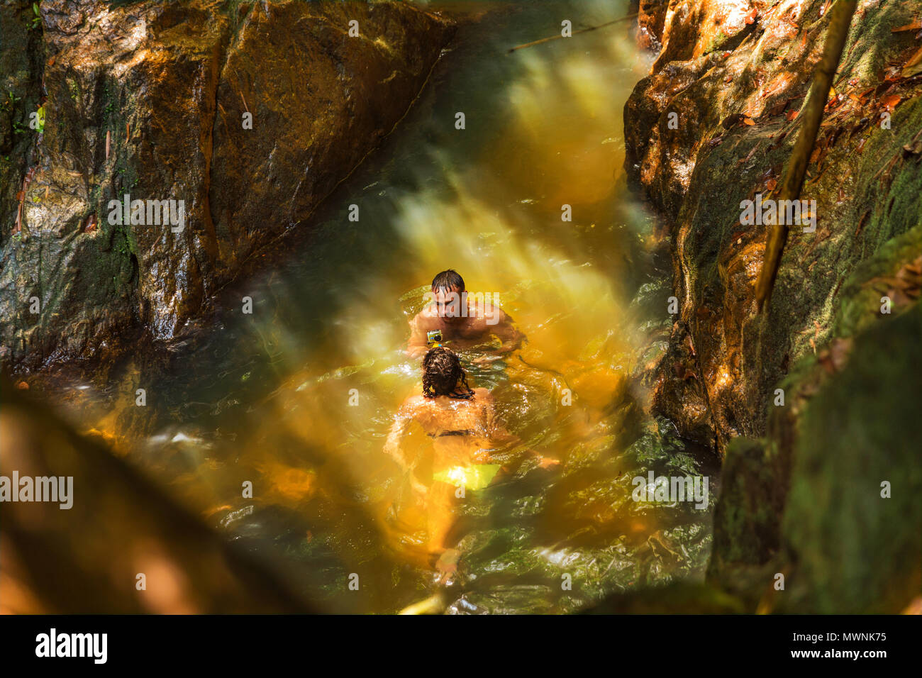 Couple bathing in waterfall hi-res stock photography and images - Alamy