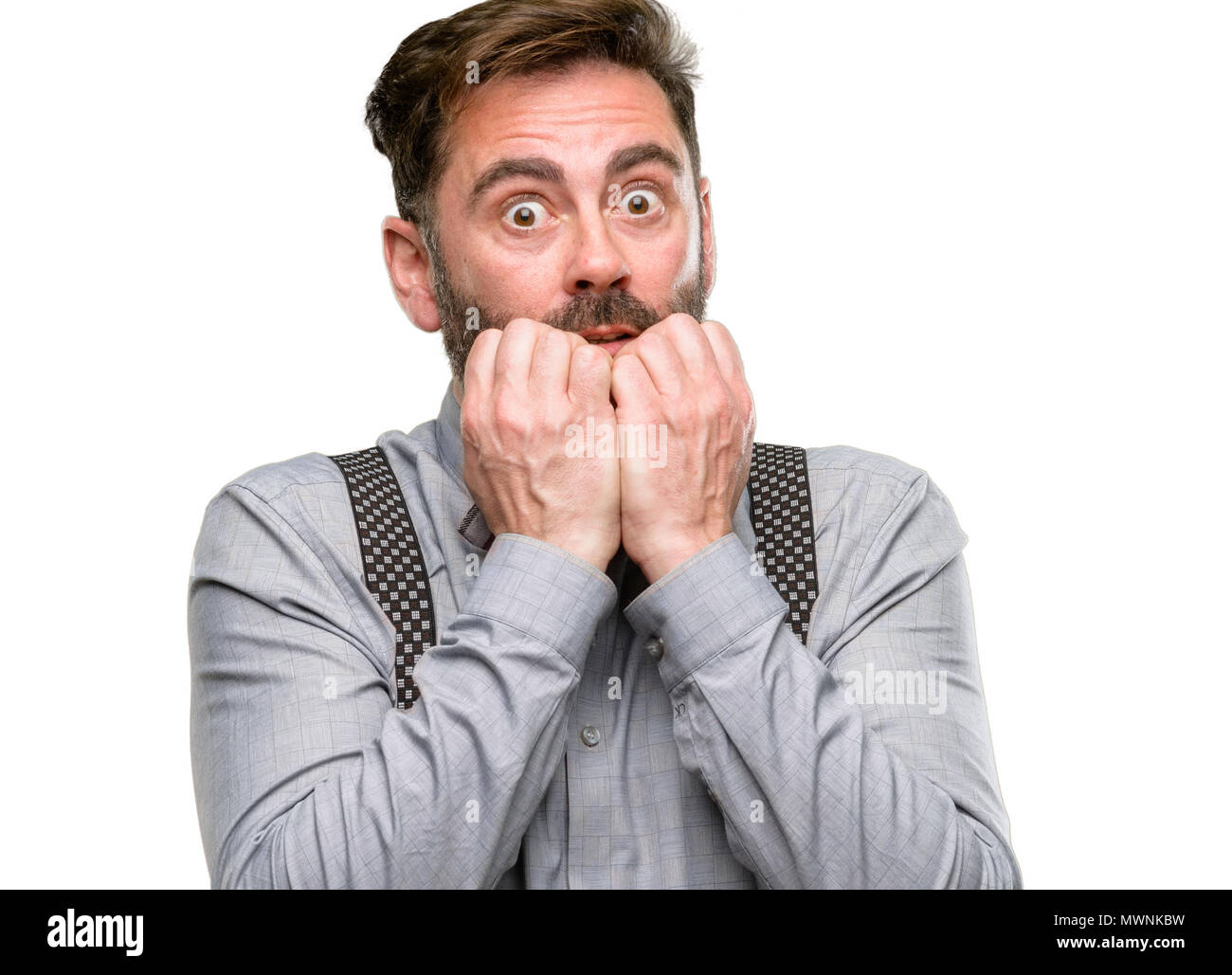 Middle age man, with beard and bow tie terrified and nervous expressing ...