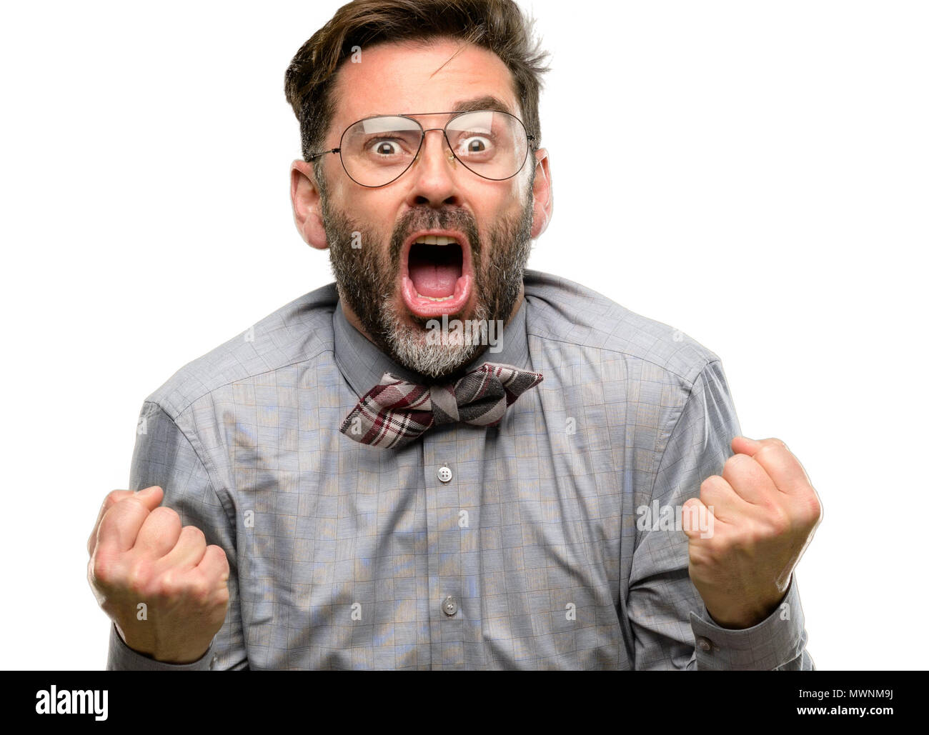 Middle age man, with beard and bow tie happy and excited celebrating ...