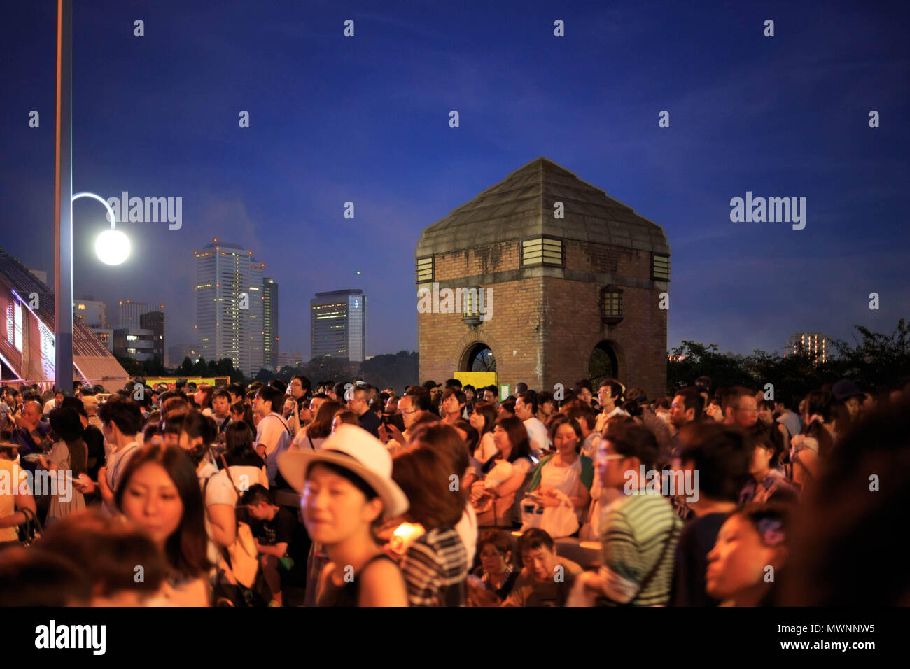Osaka, Japan - July 25, 2015: Crowd waits for fireworks display during ...