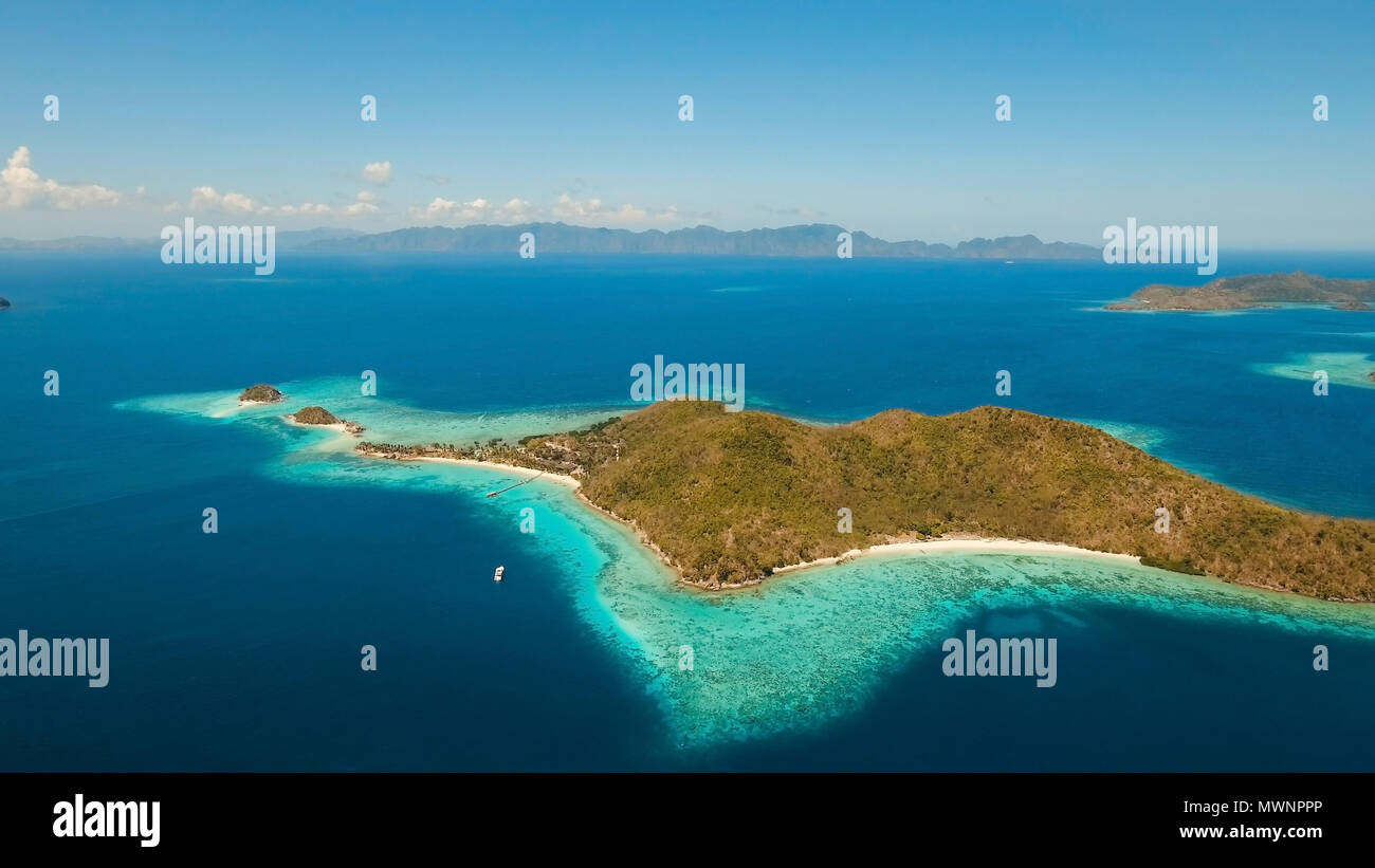 Aerial view: Lagoon with blue, azure water in the middle of small ...