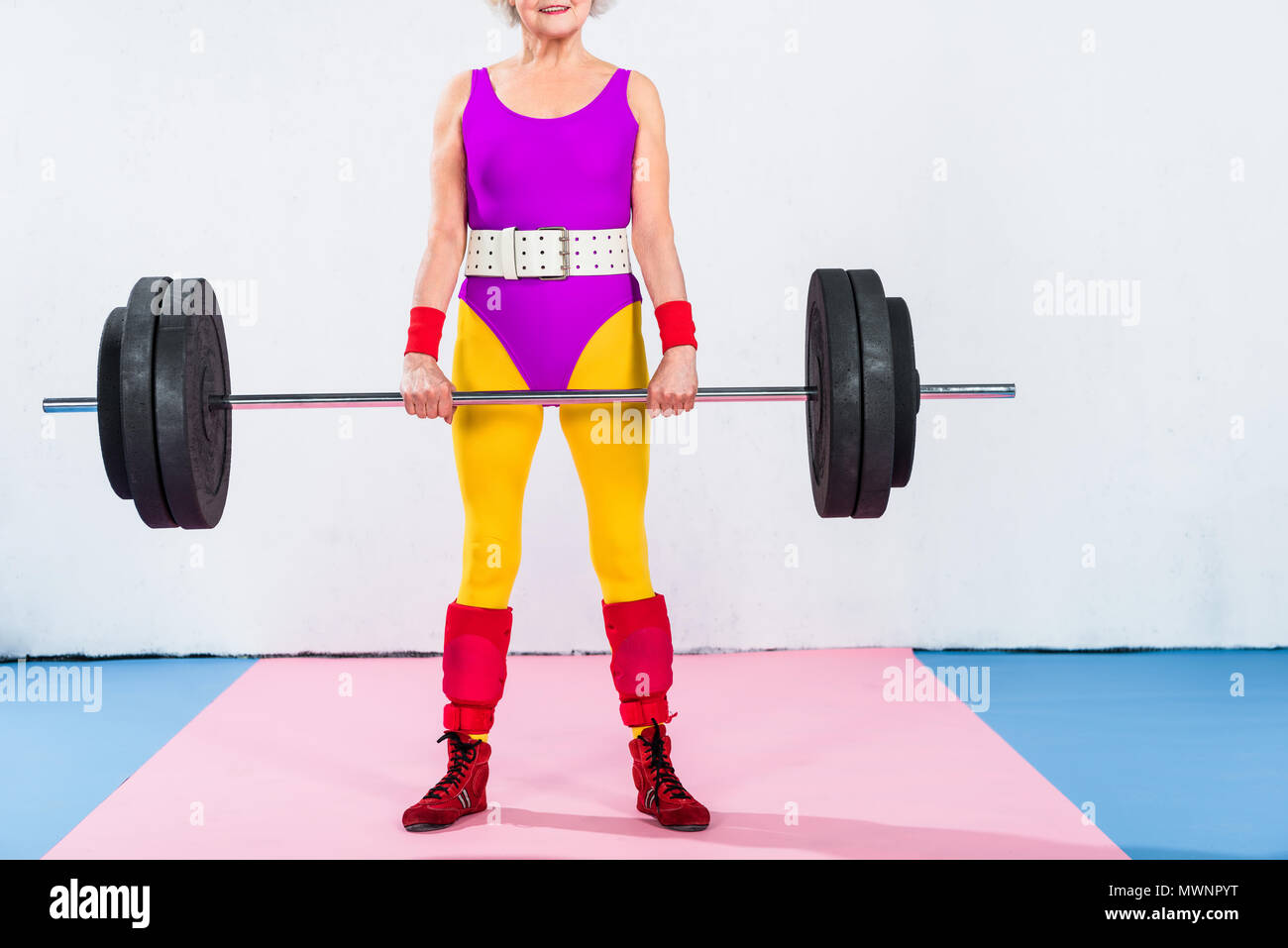 Elderly lady lifting barbell hi-res stock photography and images - Alamy