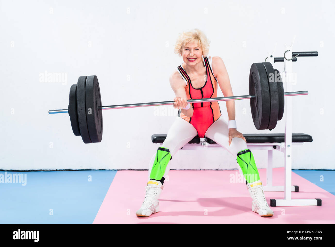 Old lady lifting weights hi-res stock photography and images - Alamy