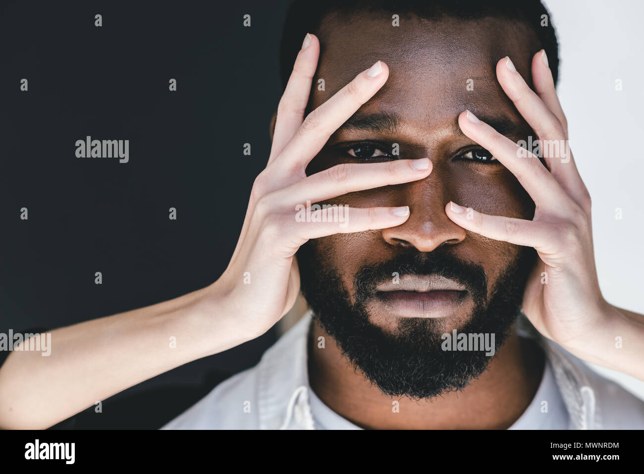 cropped image of girlfriend touching african american boyfriend face ...