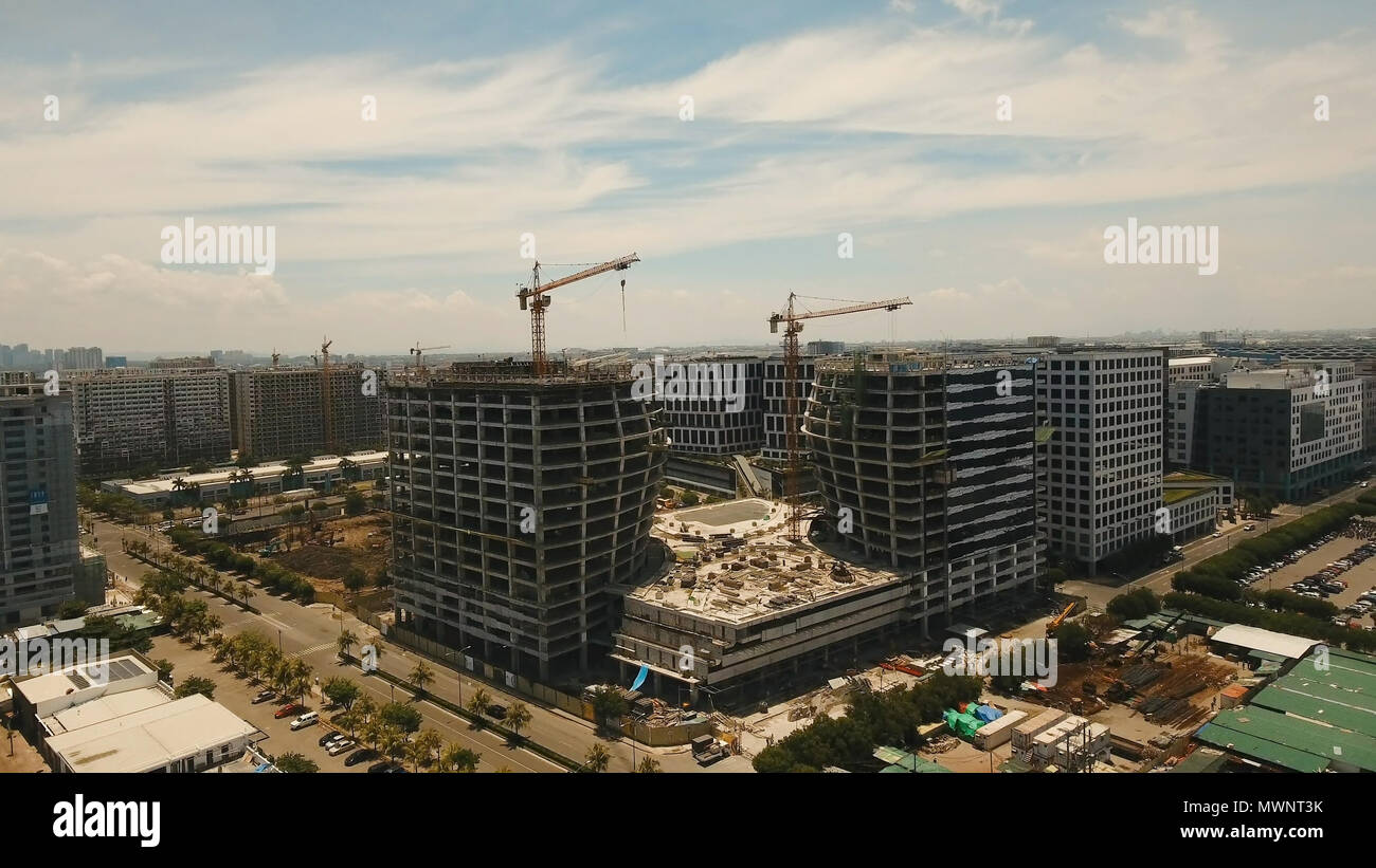 Aerial view new building is being constructed with use of tower crane ...