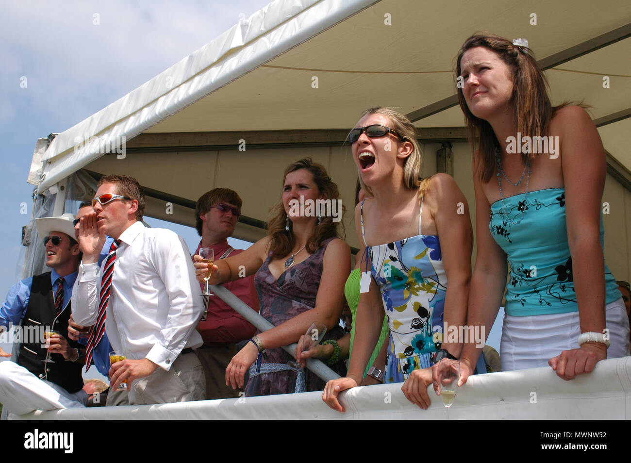 Spectators cheering the rowers on, Henley Royal Regatta, Oxfordshire ...