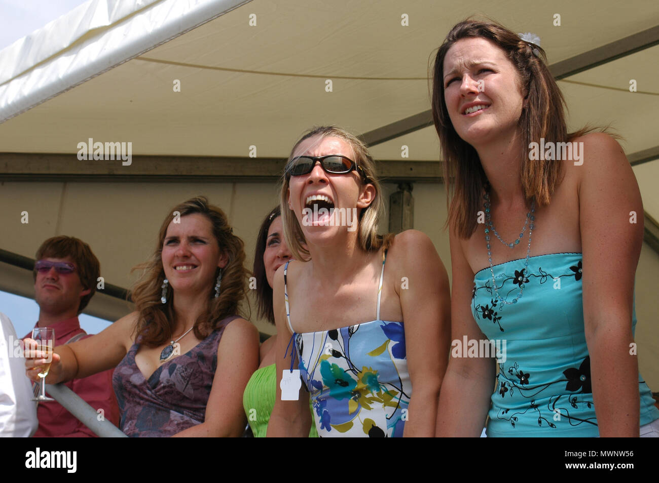 Spectators cheering the rowers on, Henley Royal Regatta, Oxfordshire ...