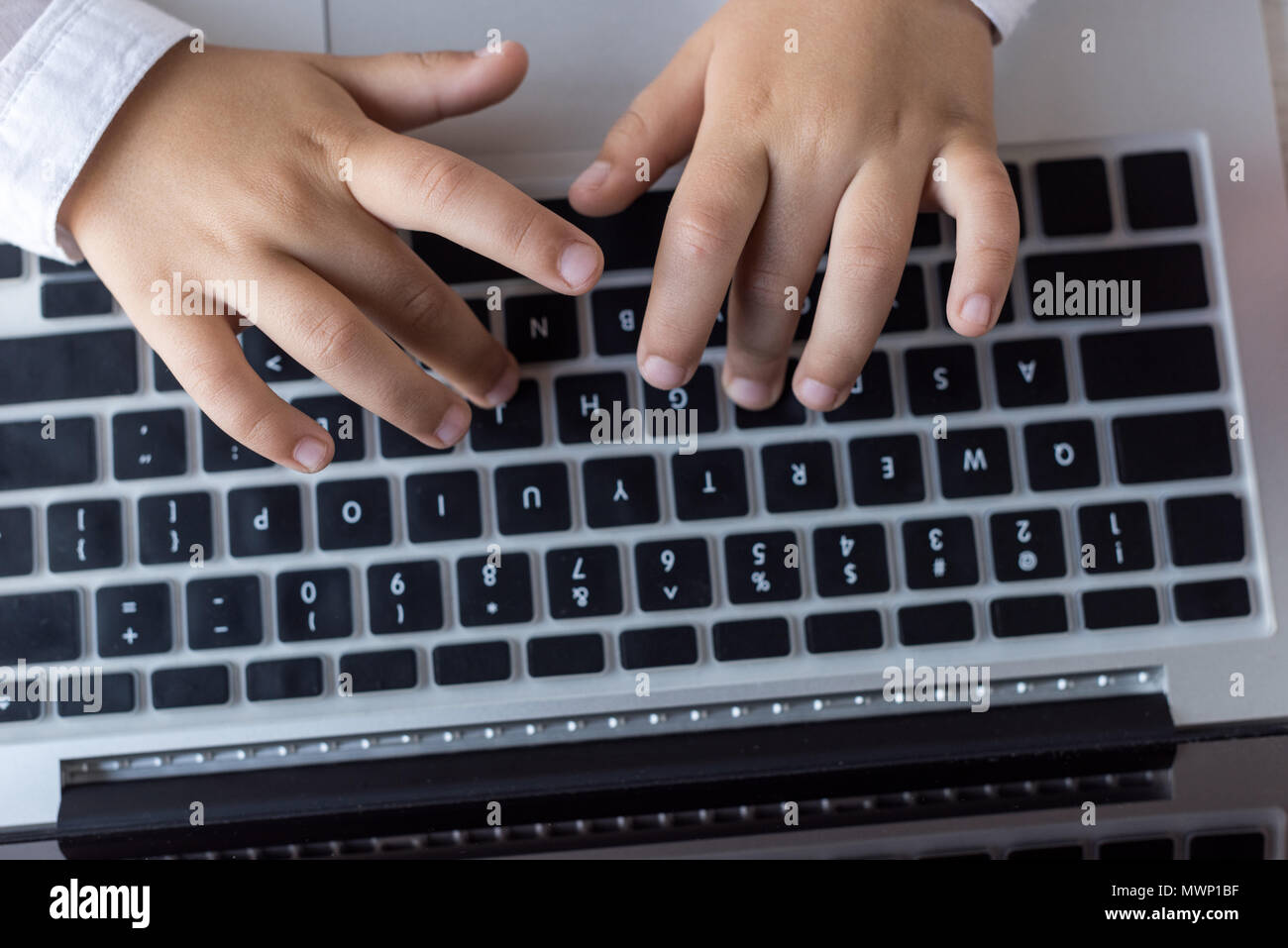 cropped shot of little child using laptop and typing on keyboard Stock ...