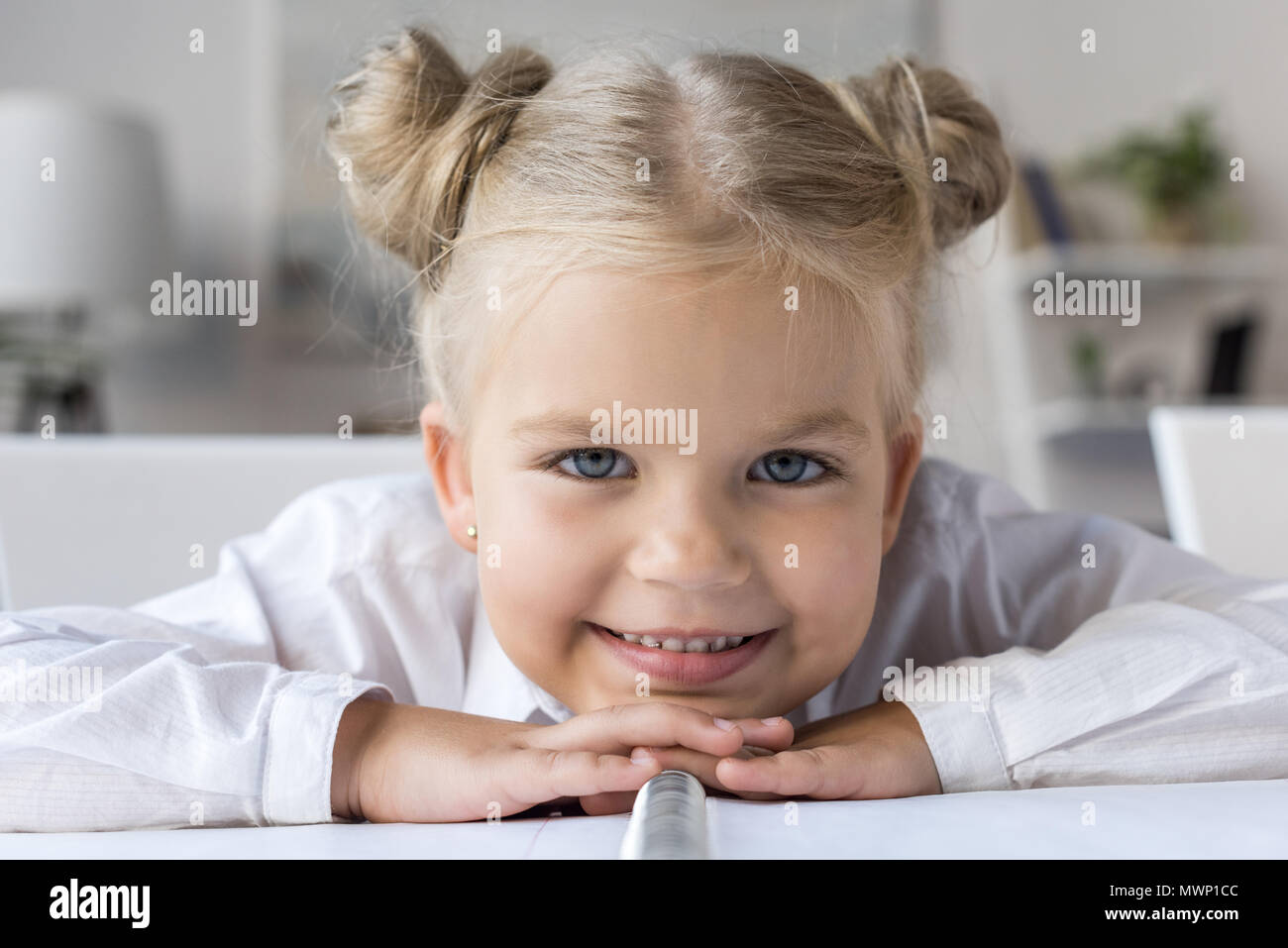 close-up portrait of adorable little girl smiling at camera Stock Photo ...