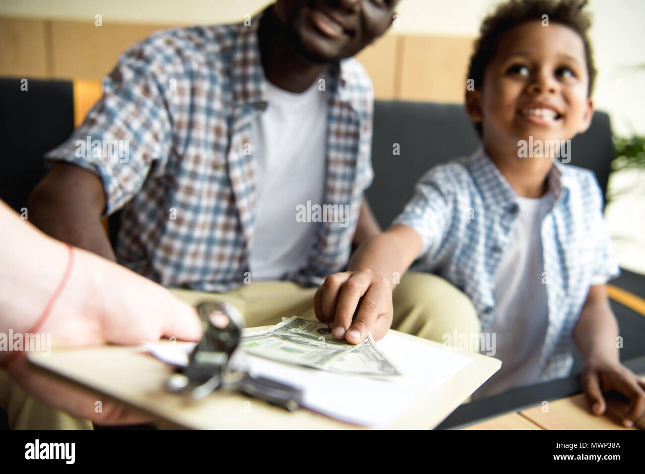 Parent giving money to adult child hi-res stock photography and images ...