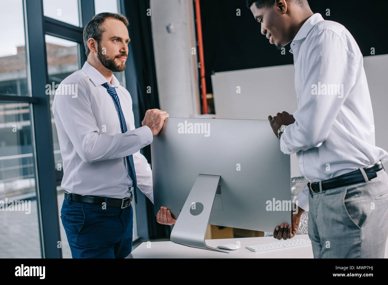 Holding desktop hi-res stock photography and images - Alamy