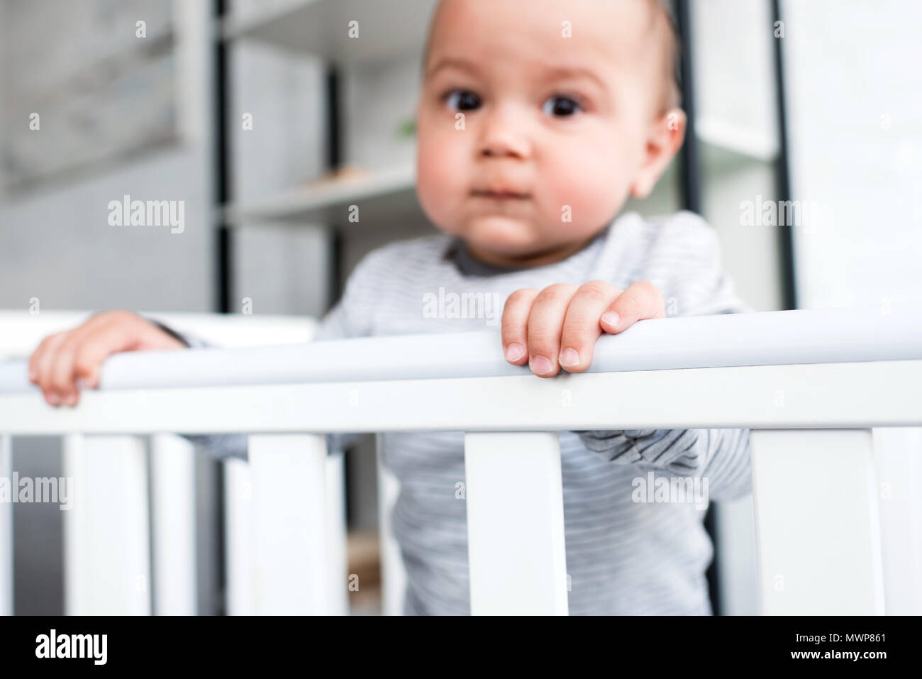 Child in the cot hi-res stock photography and images - Alamy