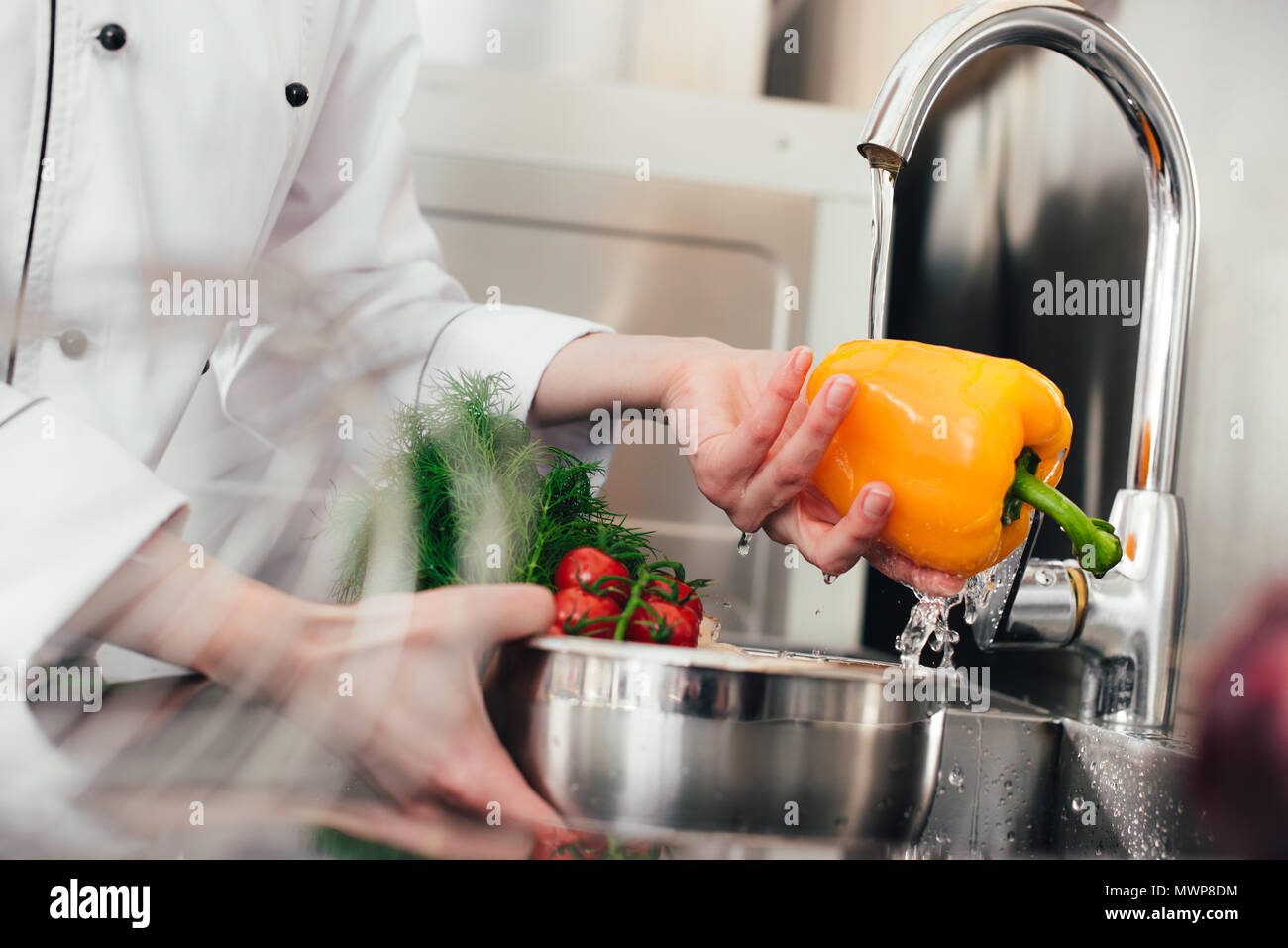 Cook washing hi-res stock photography and images - Alamy