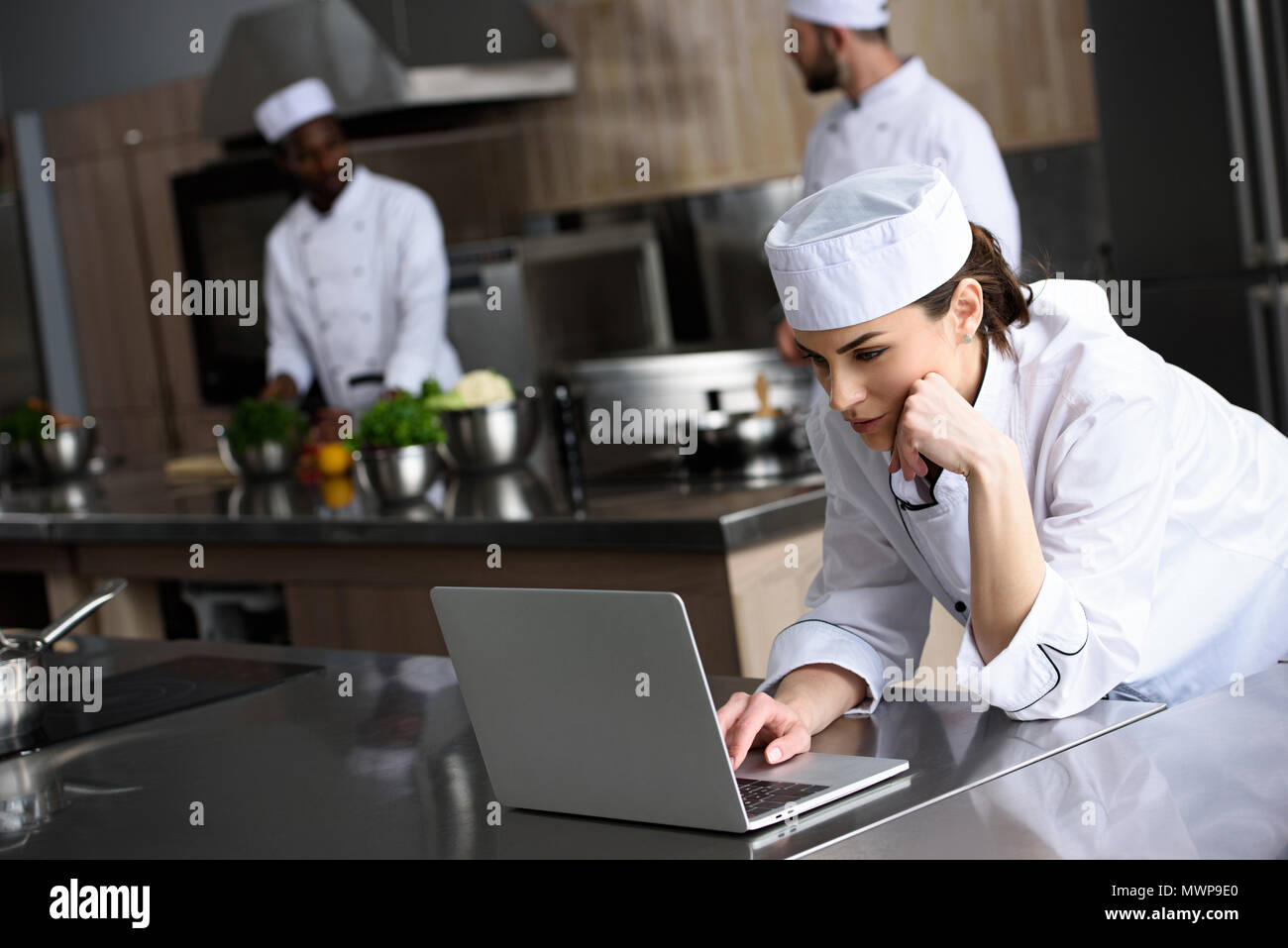 Female chef using digital hi-res stock photography and images - Alamy