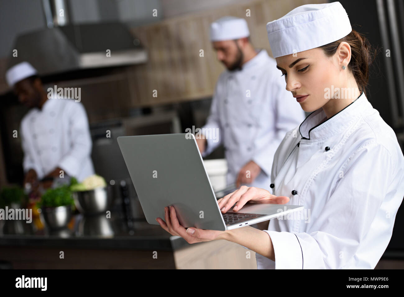 Woman cooks kitchen using hi-res stock photography and images - Alamy