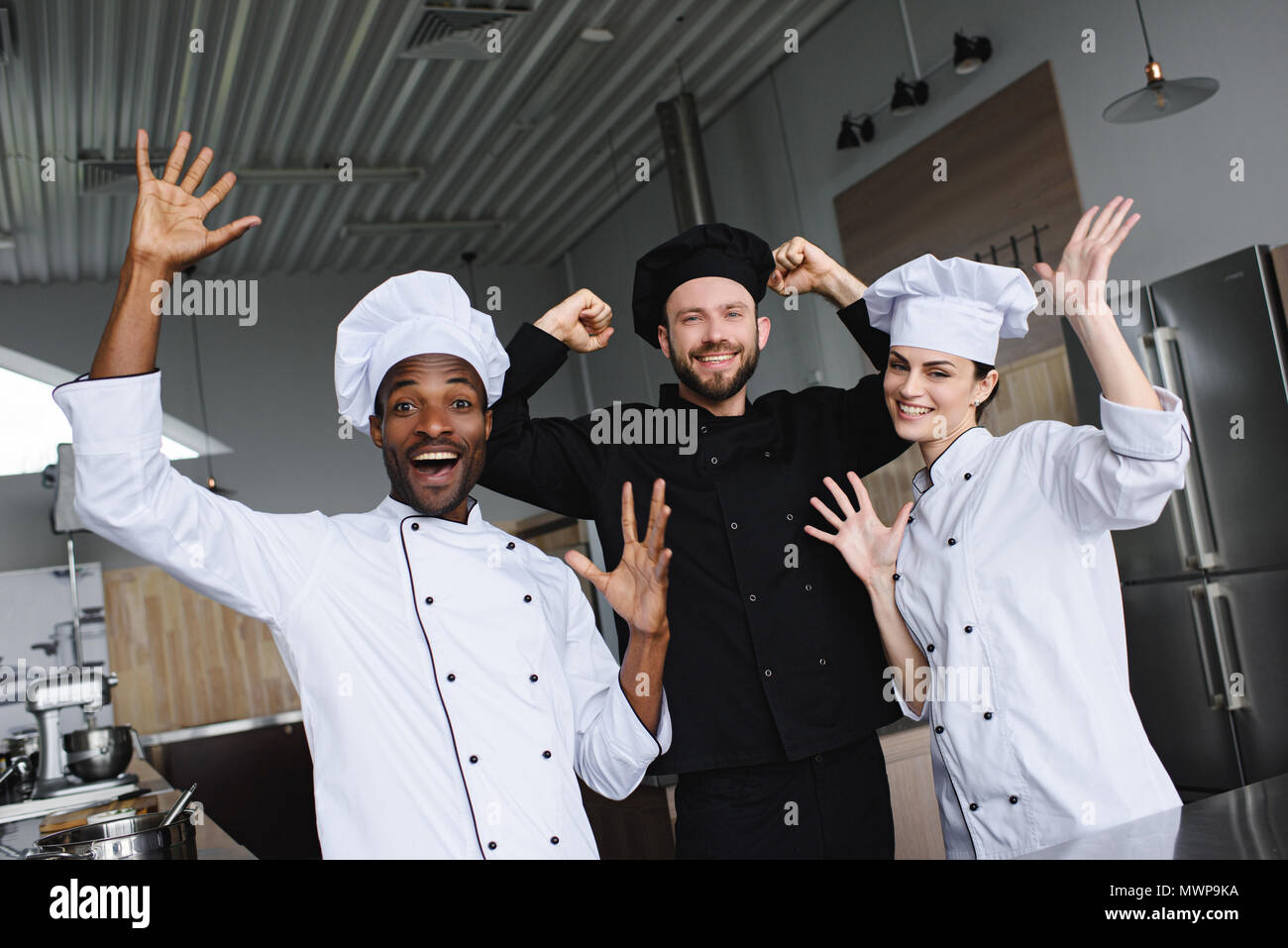 smiling multicultural chefs having fun at restaurant kitchen Stock ...