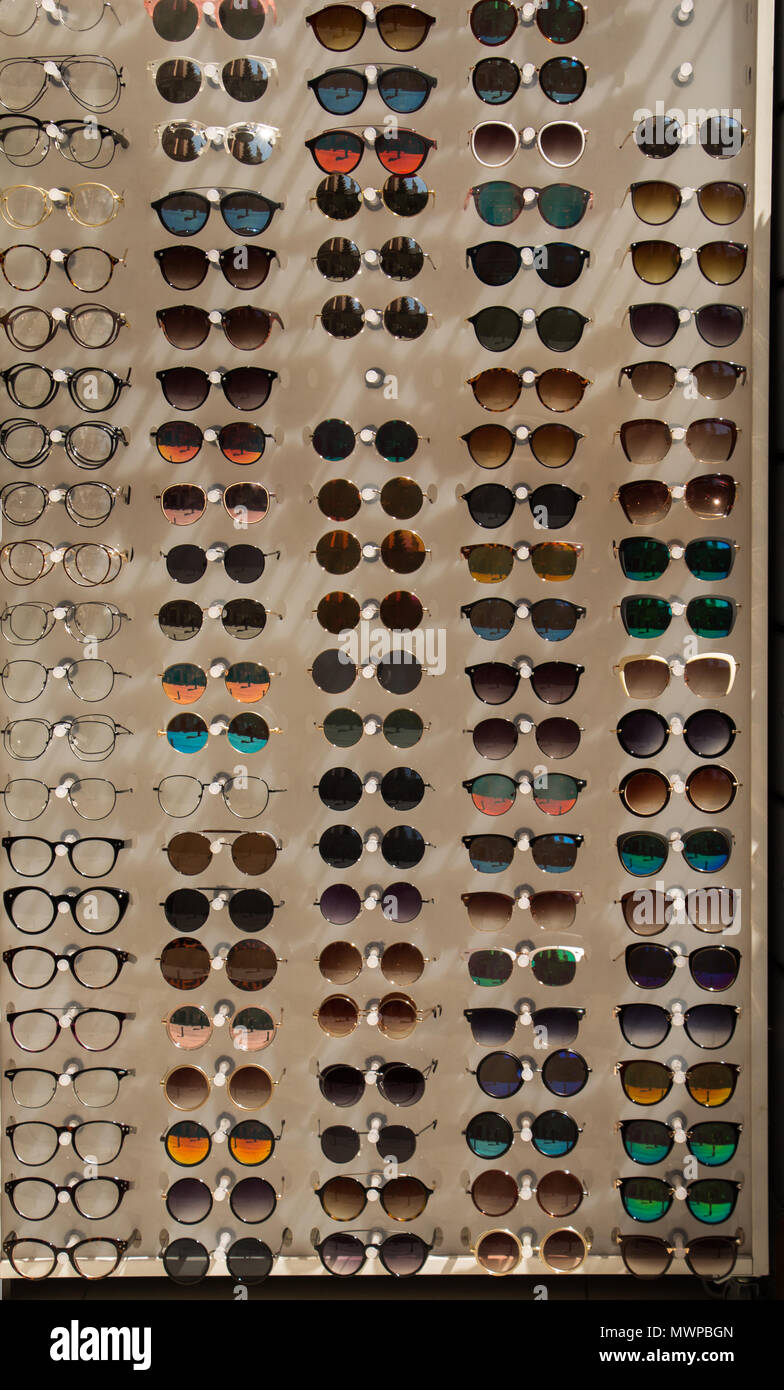 set of different colored glasses as a background Stock Photo - Alamy